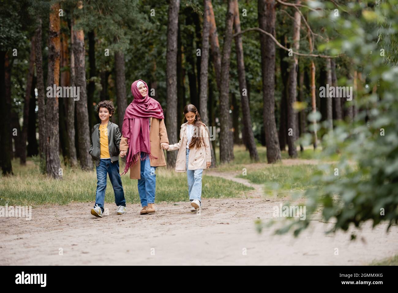 Muslim family walking park hi-res stock photography and images - Alamy
