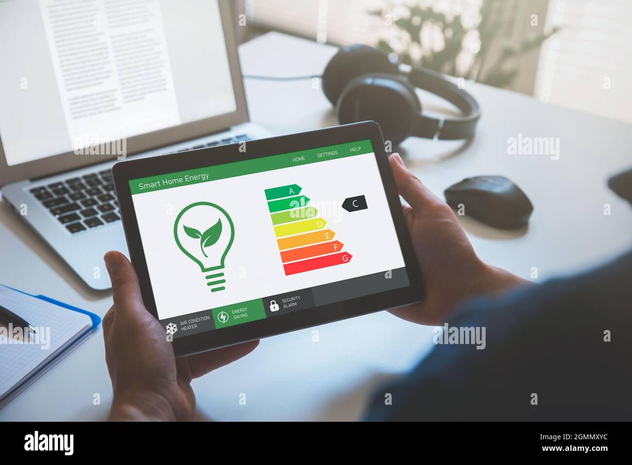 Energy efficiency mobile app on screen. Ecology, eco house concept ...