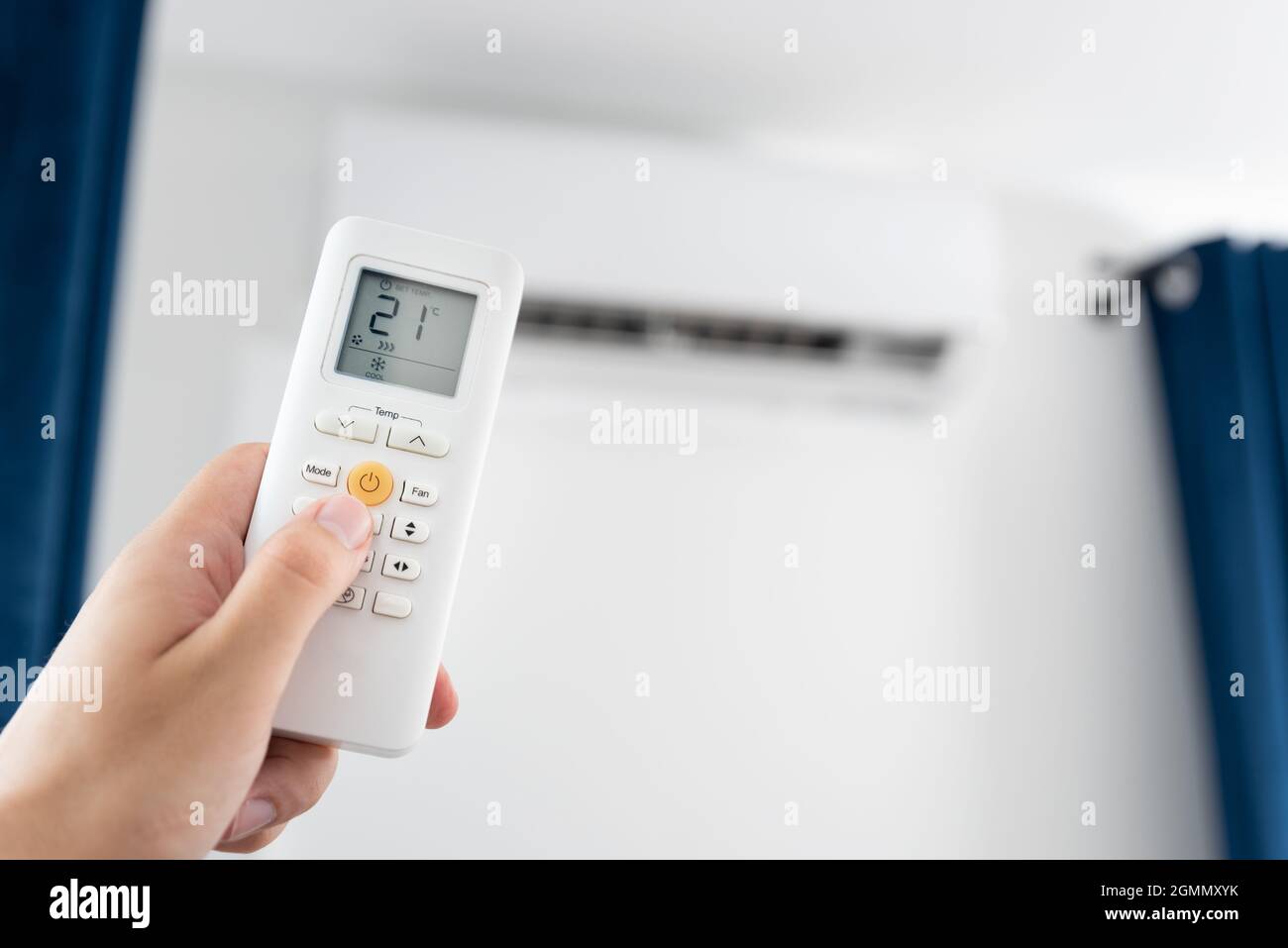 Adjusting temperature of air conditioner by remote. Air conditioning ...