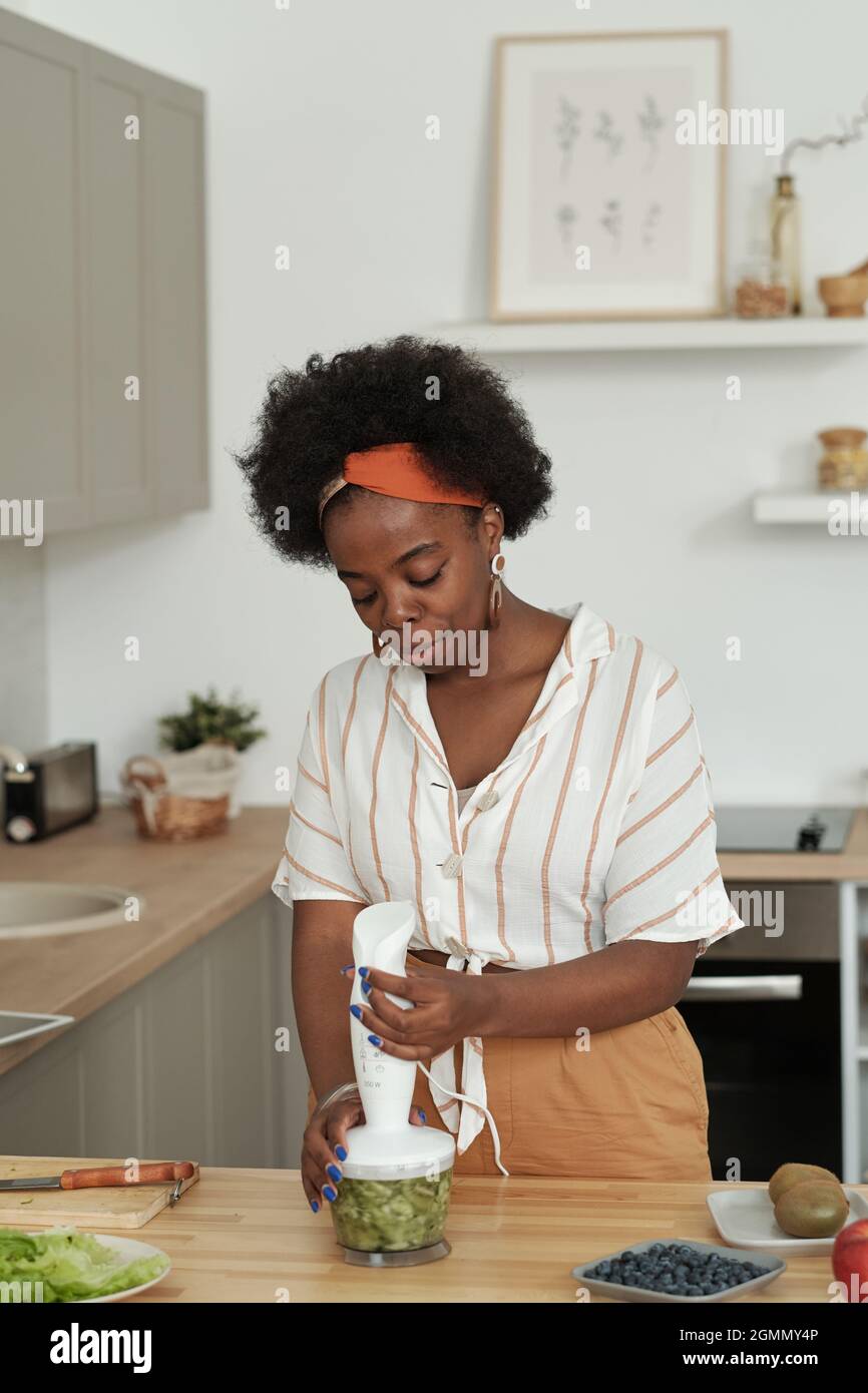 Woman bending over table hi-res stock photography and images - Alamy