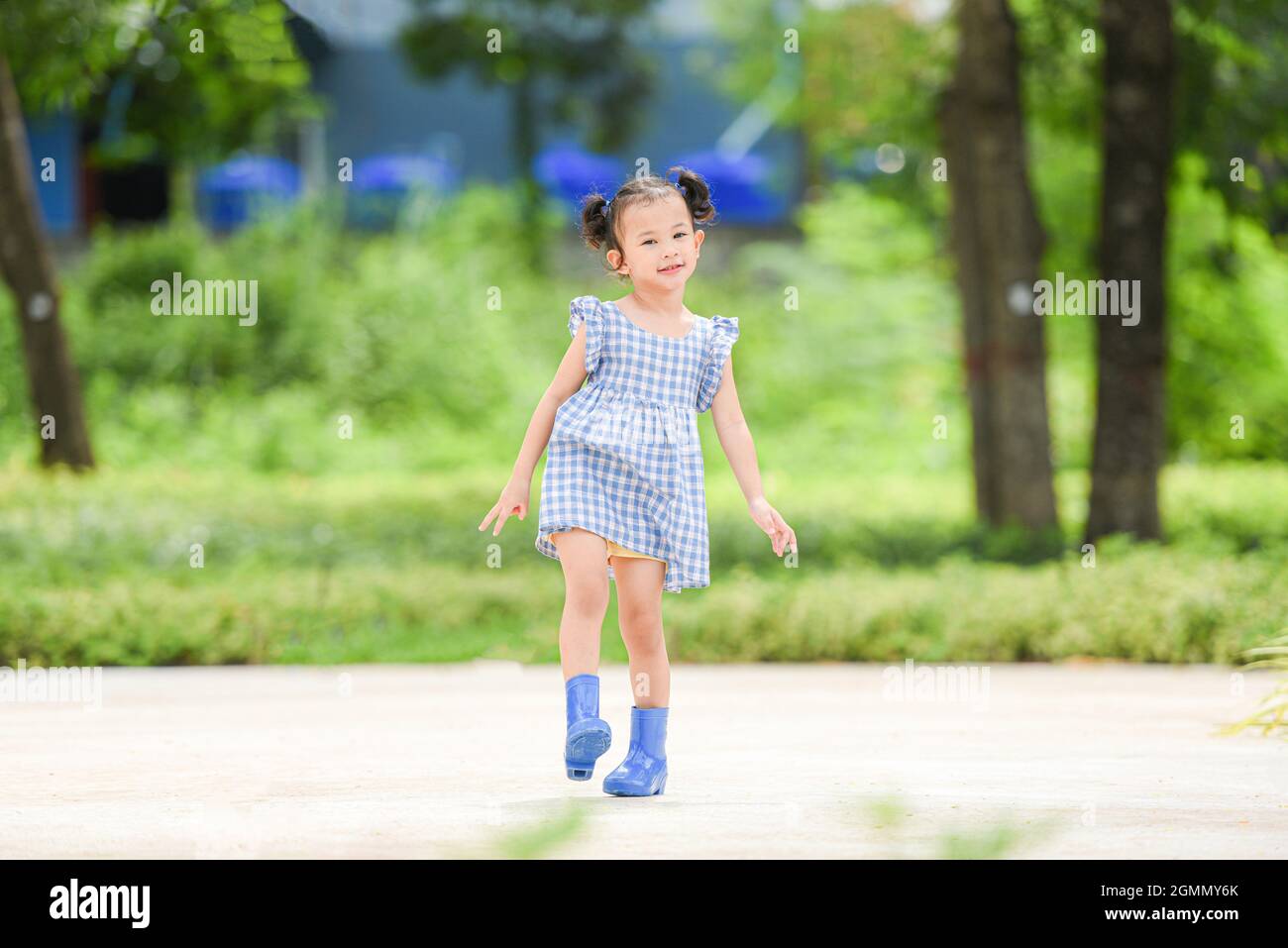 Asian kid girl happy in the park garden tree background, Beautiful ...