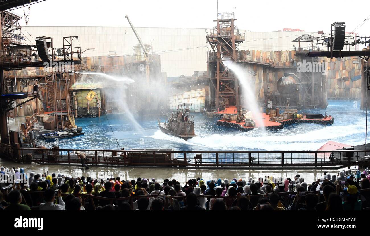 Beijing, China. 20th Sep, 2021. Tourists watch a stunt performance at ...