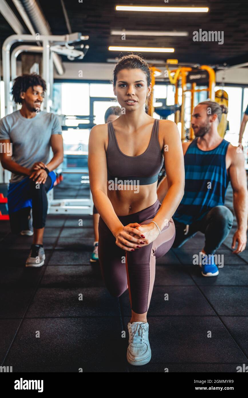Happy diverse people exercise together in gym to stay healthy Stock ...