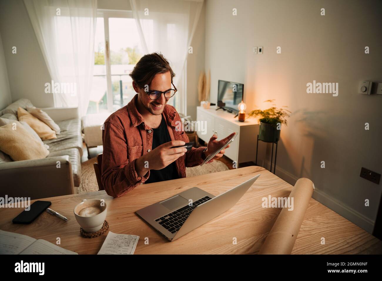 Caucasian male business man working from home making online payment ...