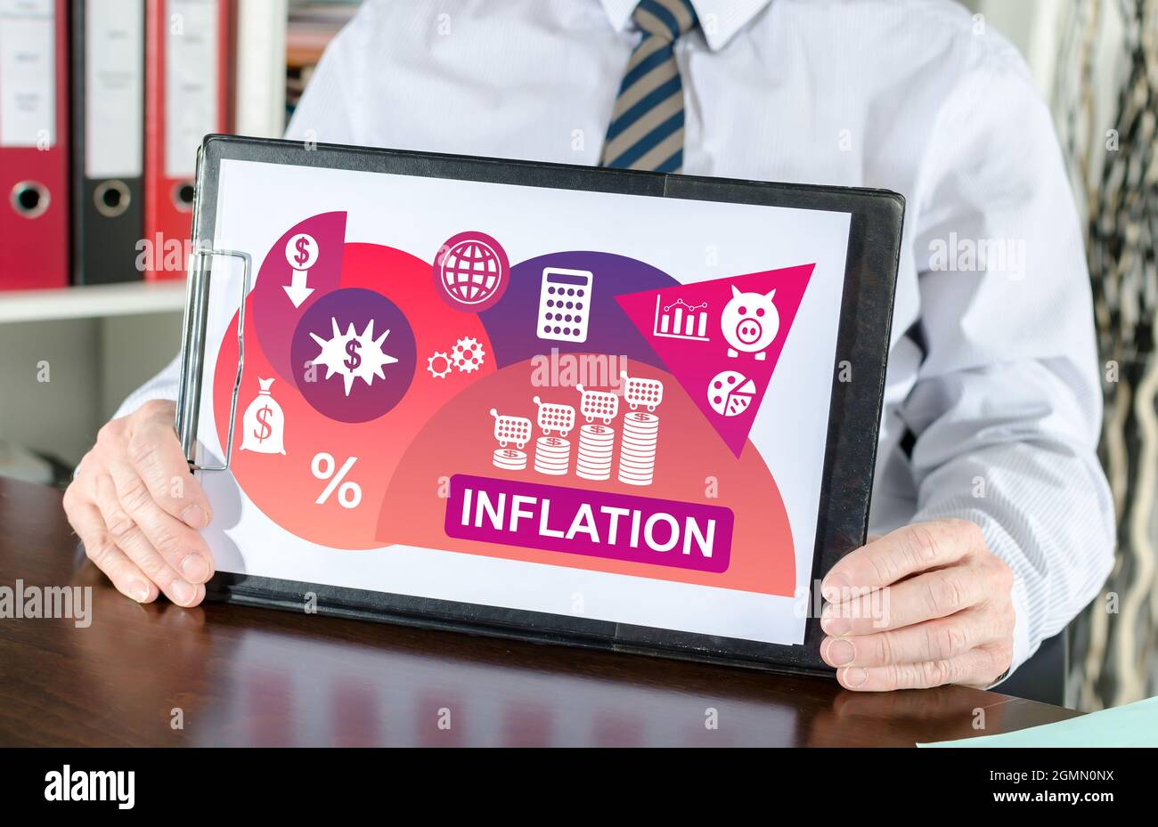 Inflation concept shown by a businessman Stock Photo - Alamy