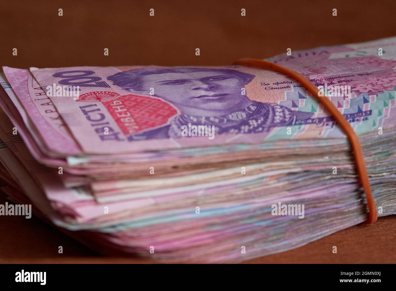 A bundle of Ukrainian money tied with an elastic band. Ukrainian ...