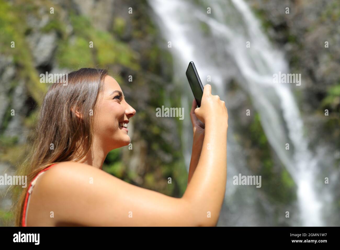 Woman lady female taking a photo photograph hi-res stock photography ...