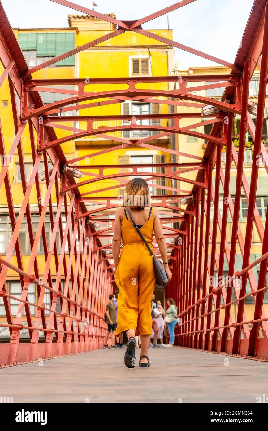Young female tourist on the famous red bridge called Eiffel Bridge in ...