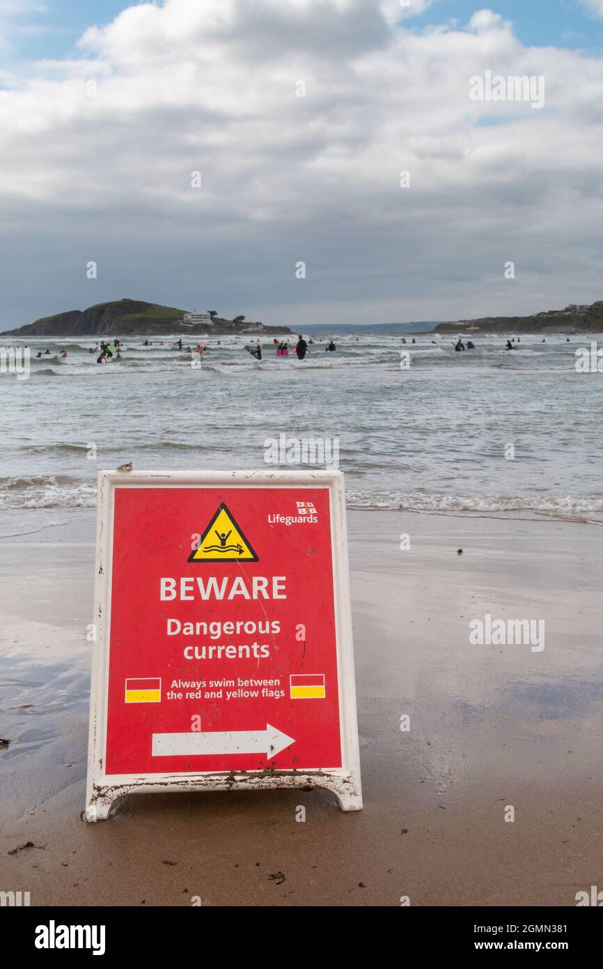 On Bantham Beach, Devon, a RNLI sign warns swimmers of dangerous ...