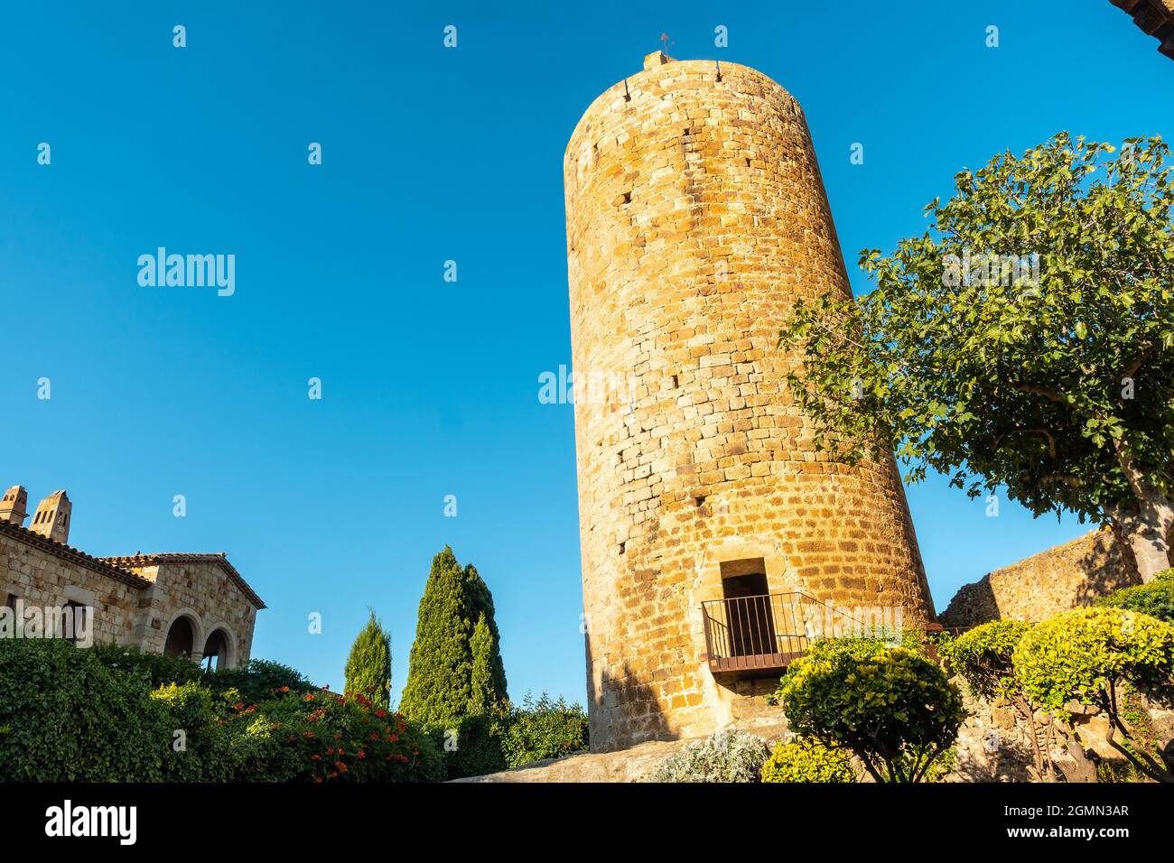 Low-angle shot of the castle in Pals in the medieval village against the blue sky Stock Photo ...