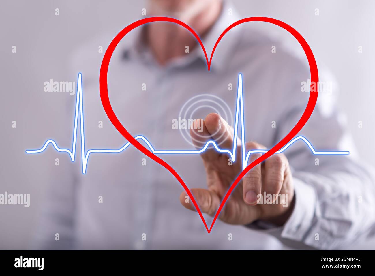 Man touching a heart beats graph on a touch screen with his finger ...