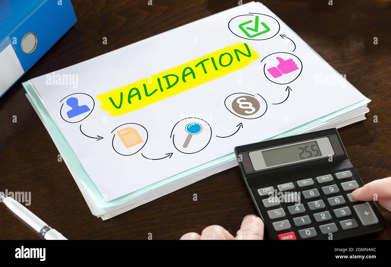 Validation concept illustrated on a paper with a calculator Stock Photo ...