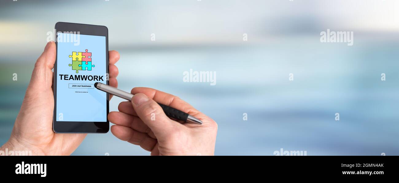 Smartphone screen displaying a teamwork concept Stock Photo - Alamy