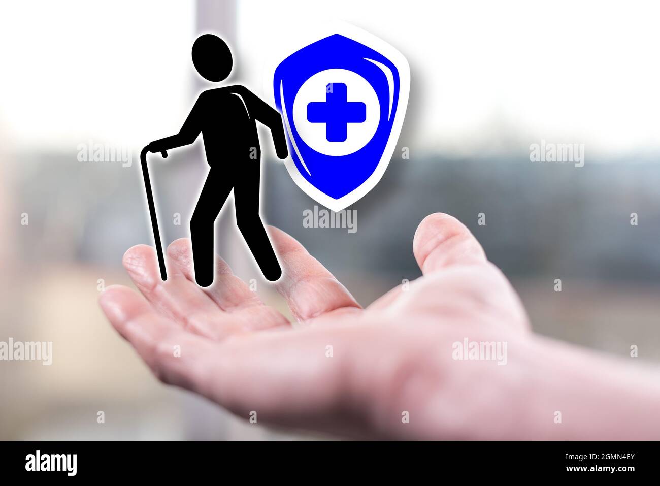 Old age insurance concept above a hand of a man Stock Photo - Alamy
