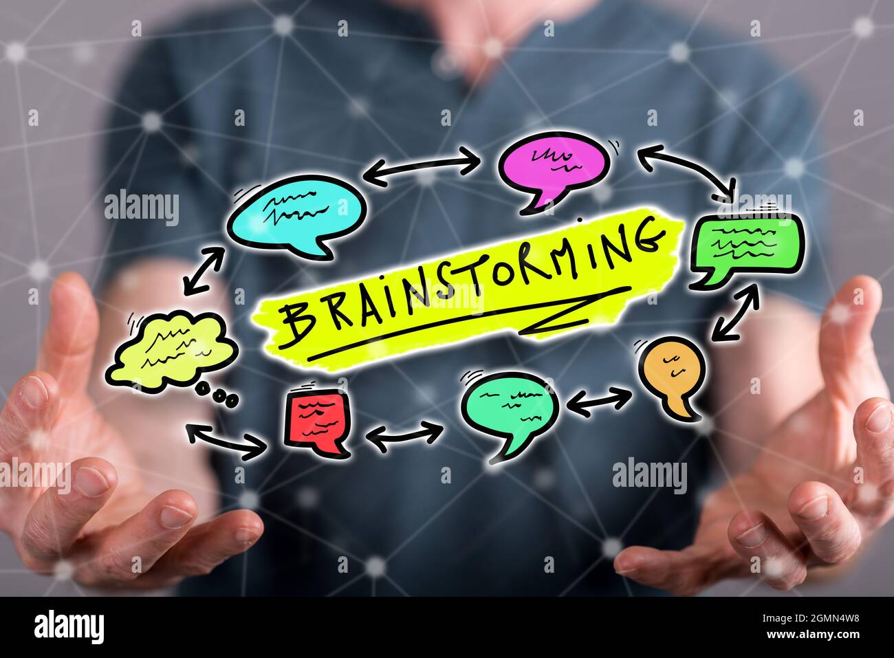 Brainstorming concept between hands of a man in background Stock Photo ...