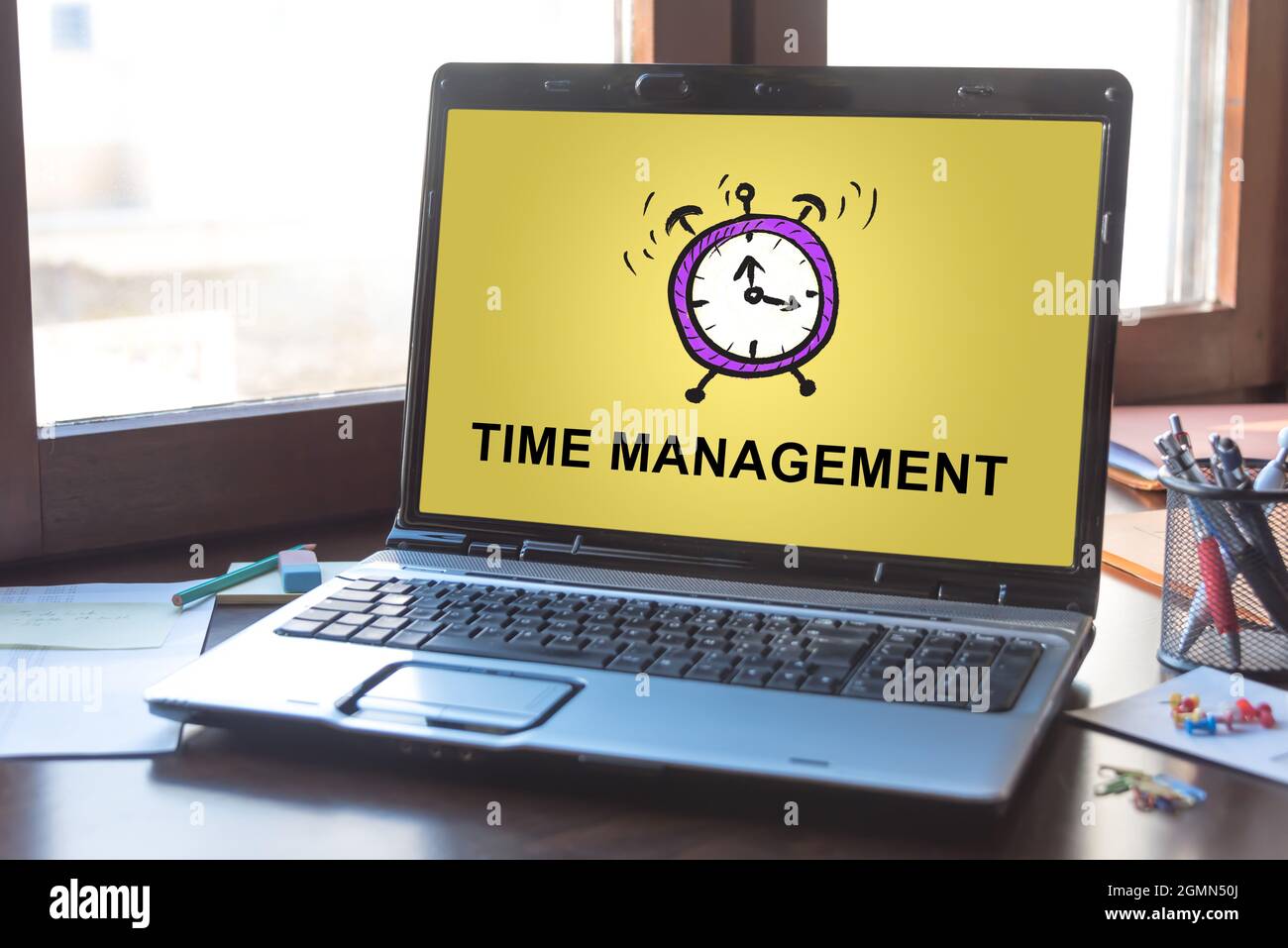 Laptop screen displaying a time management concept Stock Photo - Alamy