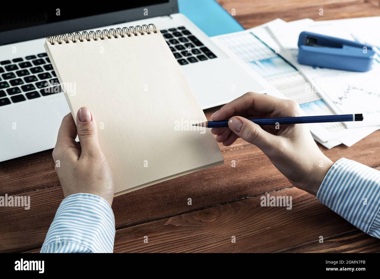woman with notepad in the office Stock Photo - Alamy