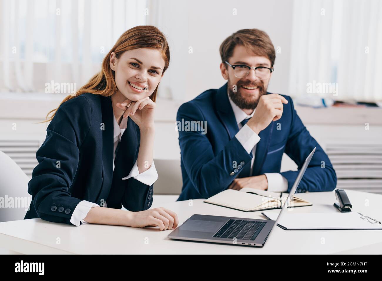 man and woman managers work together in front of laptop office ...