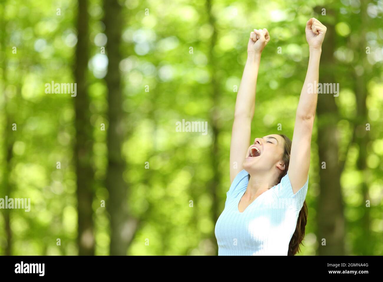 Woman raising arms hi-res stock photography and images - Alamy