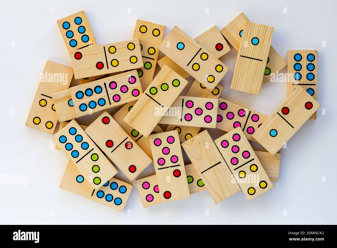Top view of heap wooden dominoes gaming pieces on white background ...