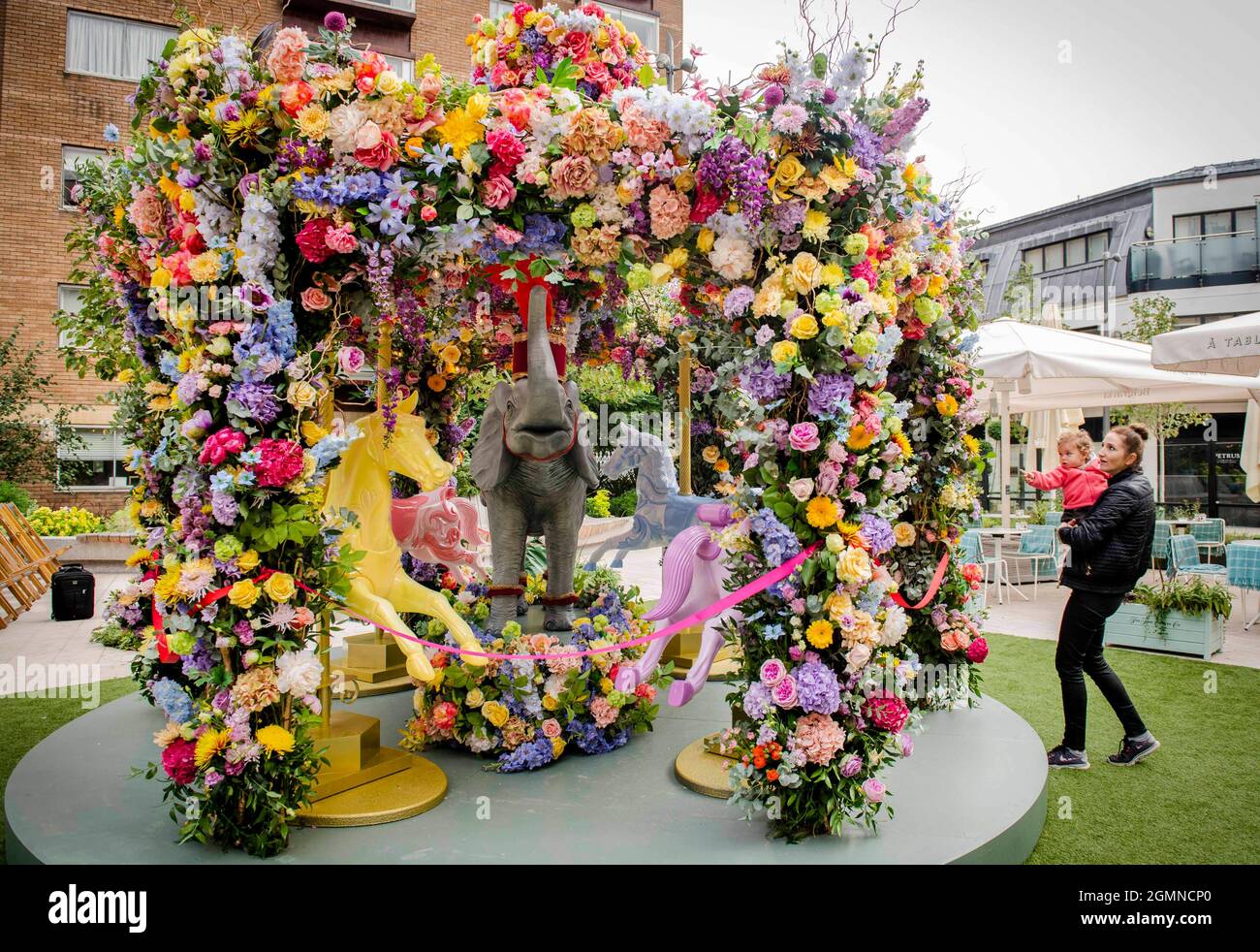 EDITORIAL USE ONLY A floral carousel installation is unveiled in Halkin ...