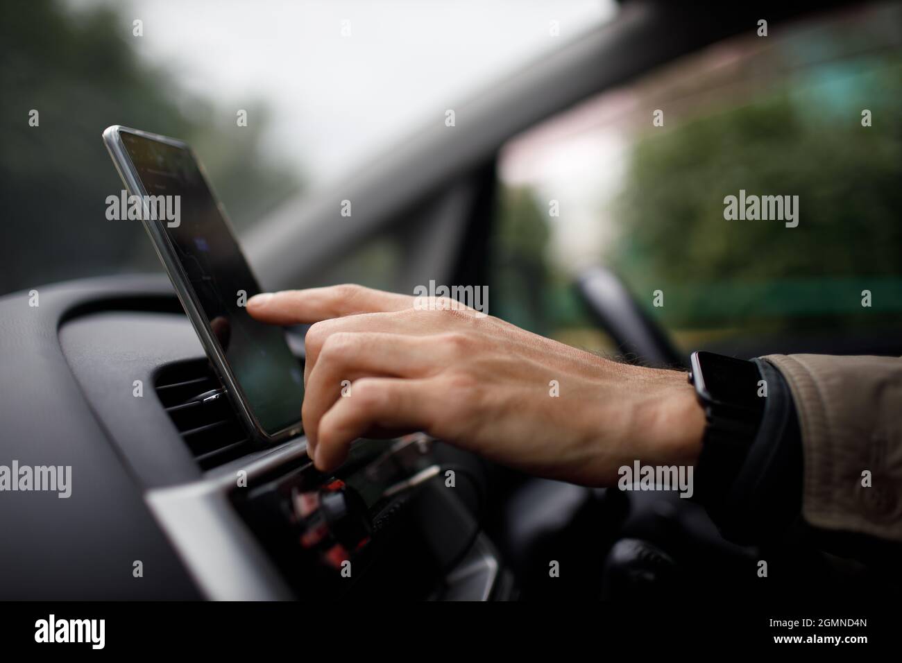 Navigator in car vehicle transportation commuter. Driver man using ...