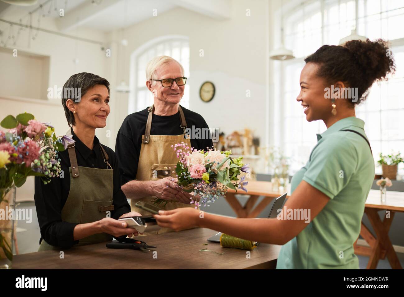 Handing plant hi-res stock photography and images - Alamy