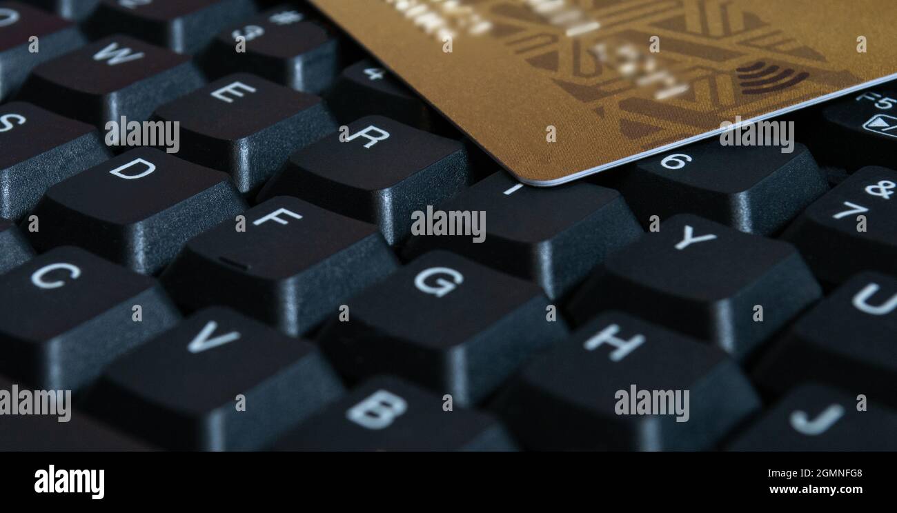 Closeup image of keyboard and credit card. Online payment and business ...