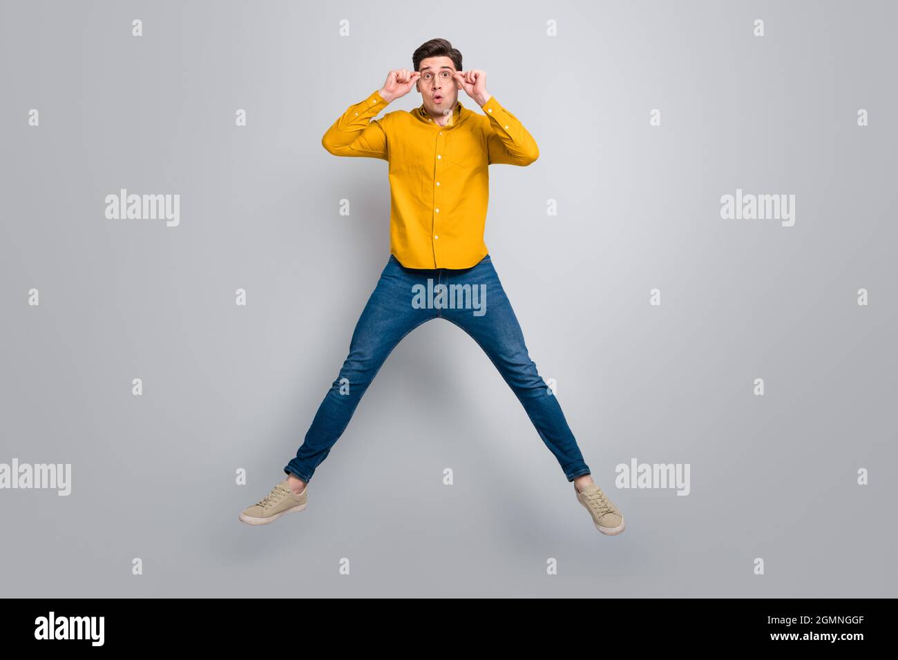 Full length body size view of attractive amazed shy man jumping ...