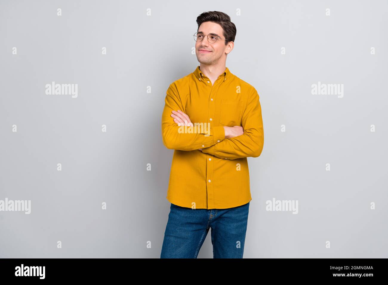 Portrait of attractive cheerful man manager folded arms thinking copy ...