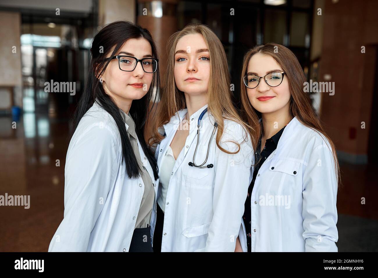 Group of students in corridor of medical university. School of nurses ...
