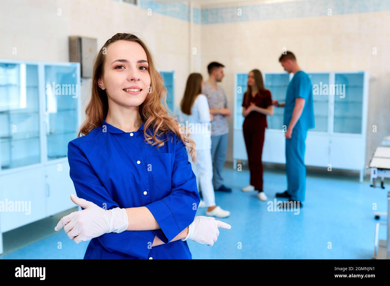 Portrait of medical student with clipboard in operating room. Space for ...