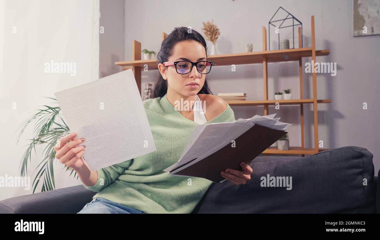 Student holding papers folder hi-res stock photography and images - Alamy
