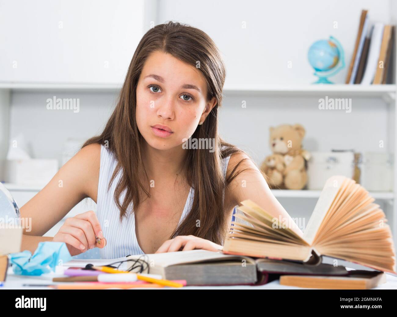 Female schooler is doing homework Stock Photo - Alamy