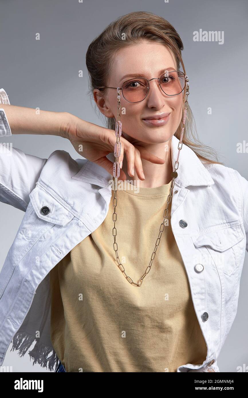 Beautiful blond business woman in modern eyeglasses. Young attractive ...