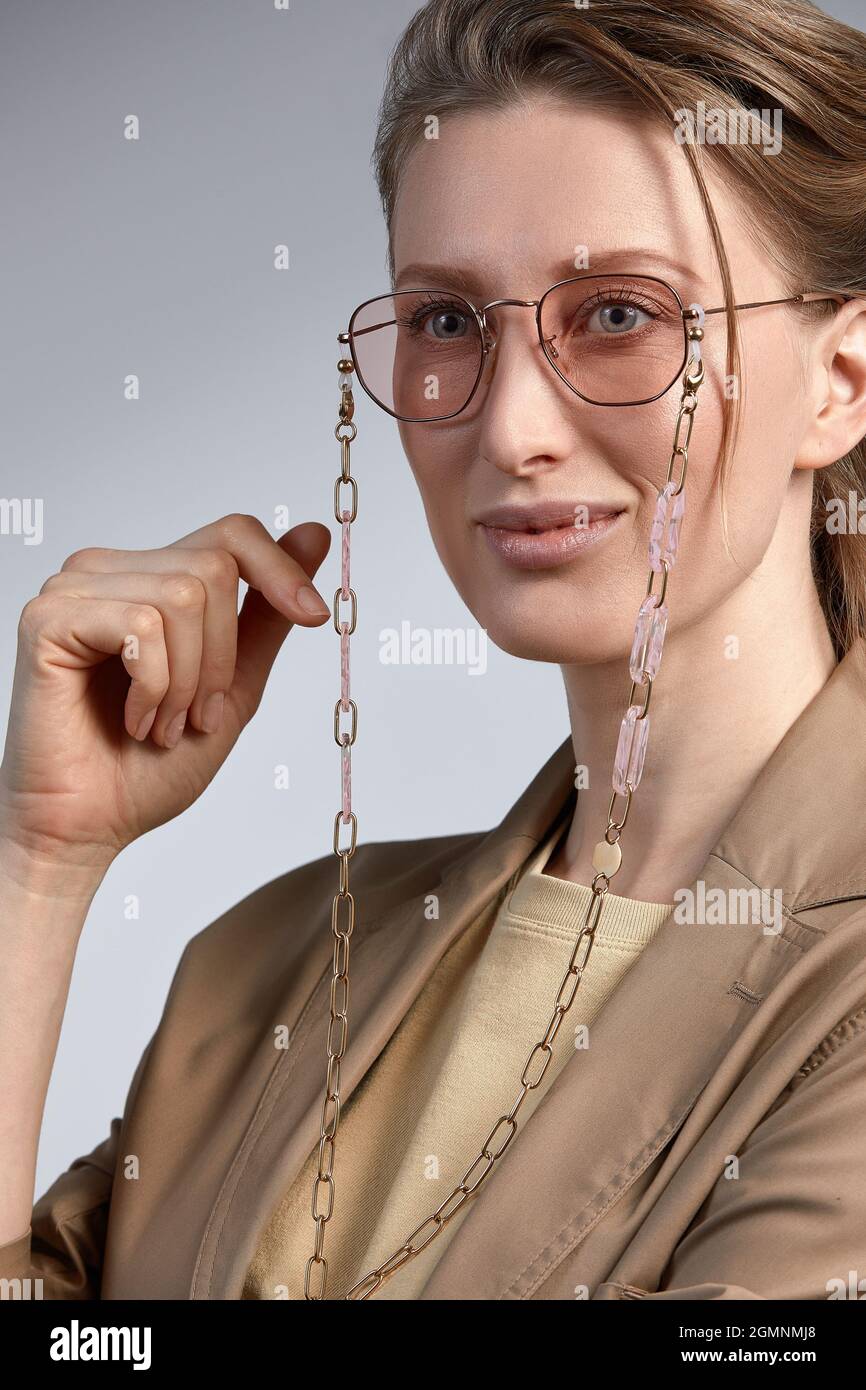 Beautiful blond business woman in modern eyeglasses. Young attractive ...