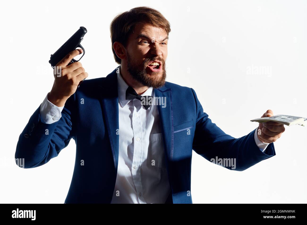 male gangster money in hand Studio emotions Stock Photo - Alamy