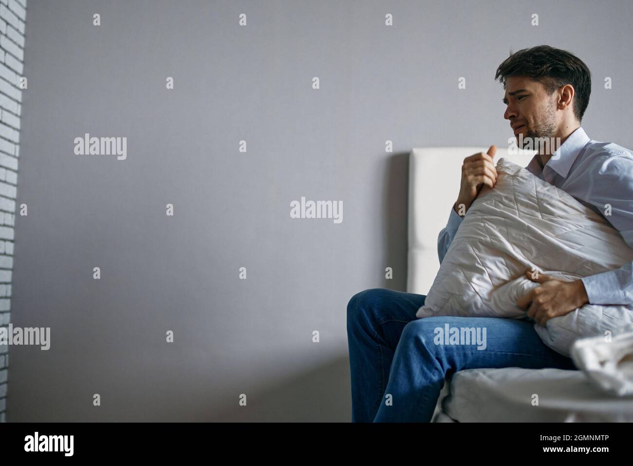 man at home loneliness depression disorder interior Stock Photo - Alamy