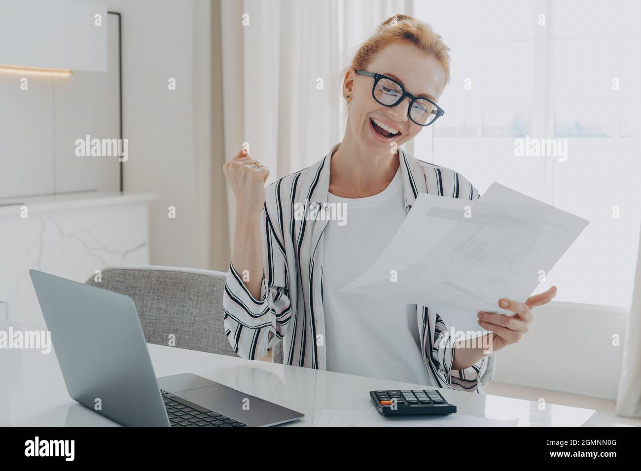 Happy woman exclaiming yes celebrating hi-res stock photography and ...
