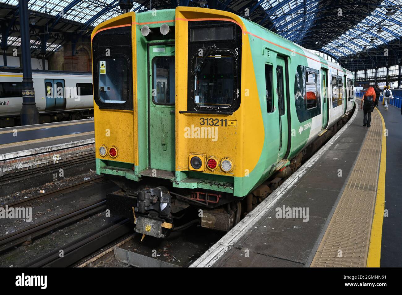 A class 313 inside Brighton station Stock Photo - Alamy