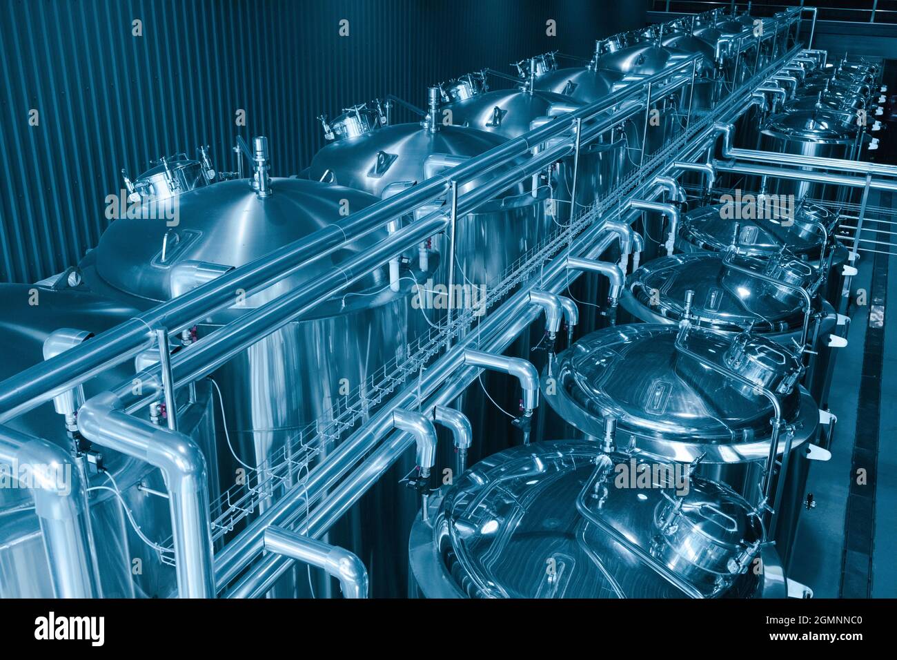 Modern interior craft beer production private microbrewery. Row of ...