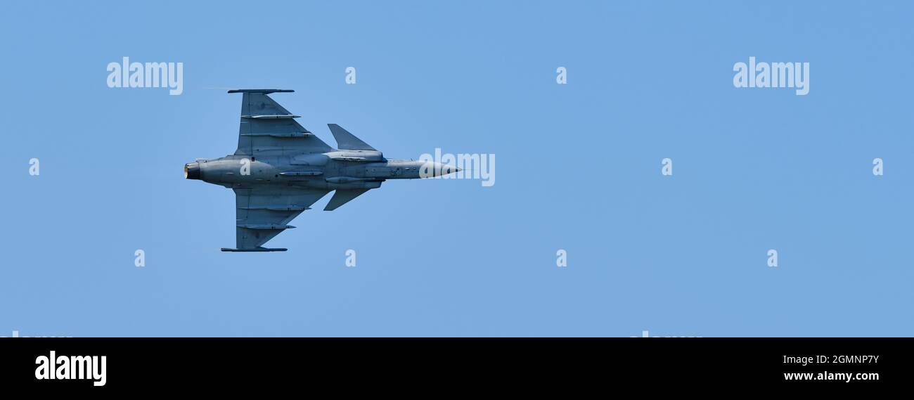 Fighter in flight in the sky down side view Stock Photo - Alamy