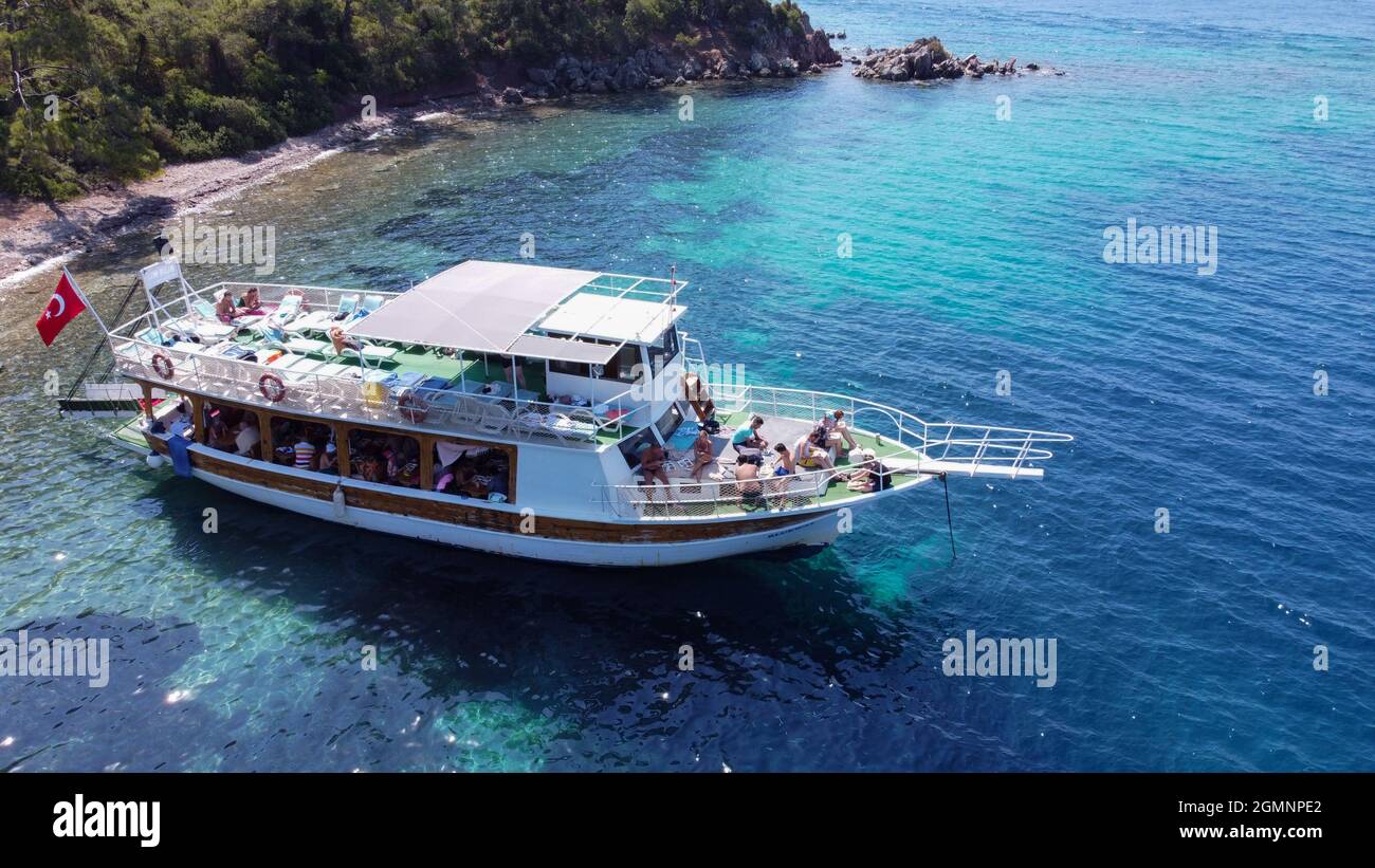 Aerial drone photo of pleasure yacht anchored in crystal clear bay and ...