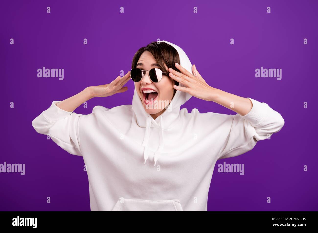 Portrait of young happy excited screaming girl in sunglass look ...