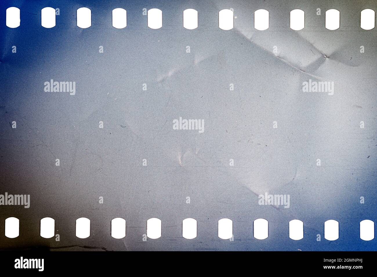 Dusty and grungy 35mm film texture or surface. Perforated camera film ...