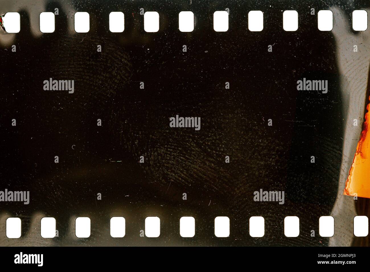 Dusty and grungy 35mm film texture or surface. Perforated camera film ...