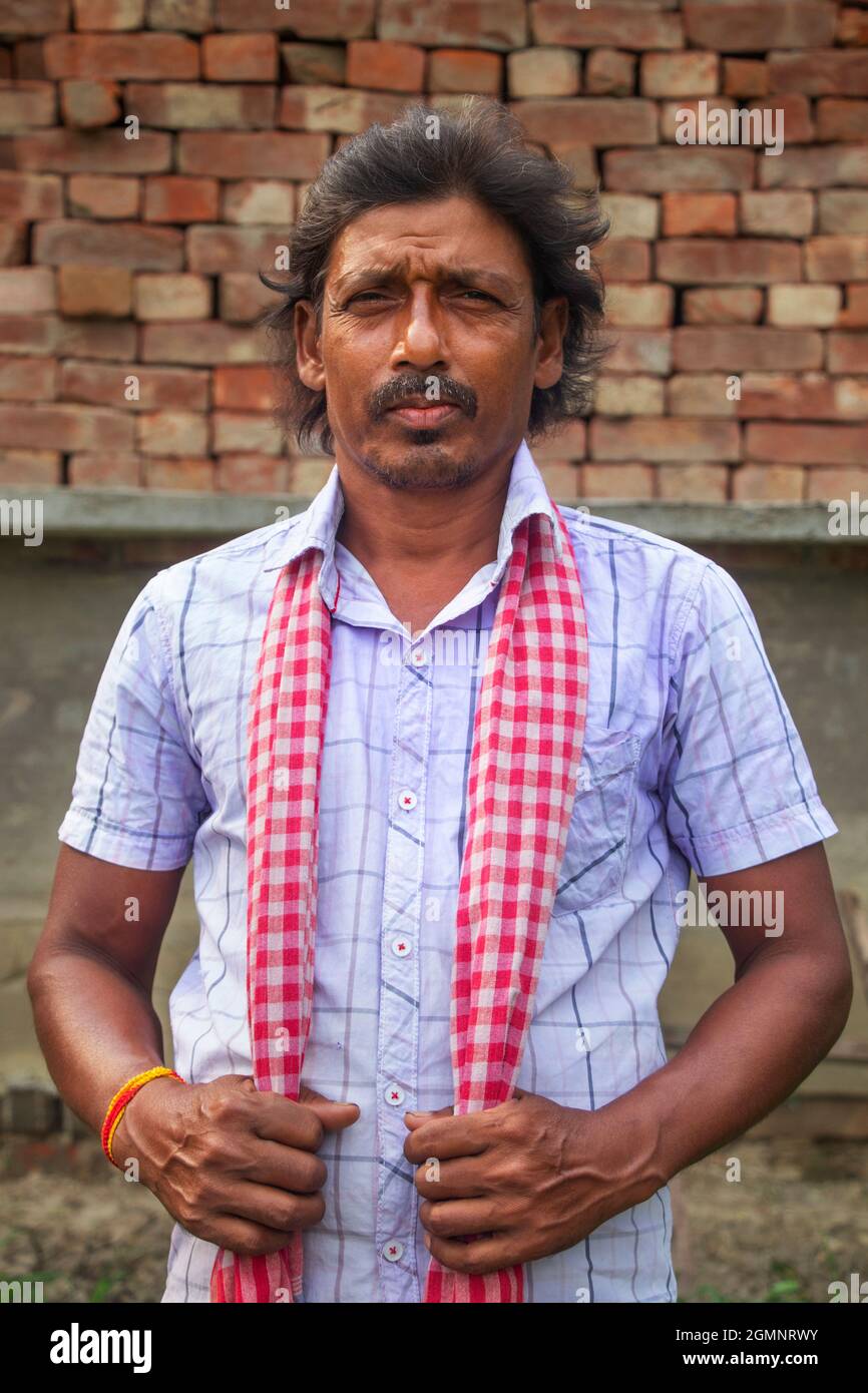 Rural man standing at home Stock Photo - Alamy