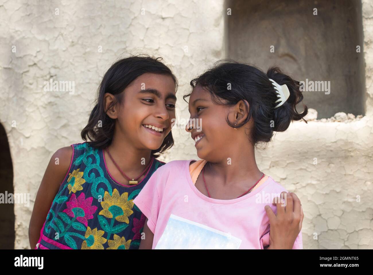Portrait of two girls rural embracing Stock Photo - Alamy