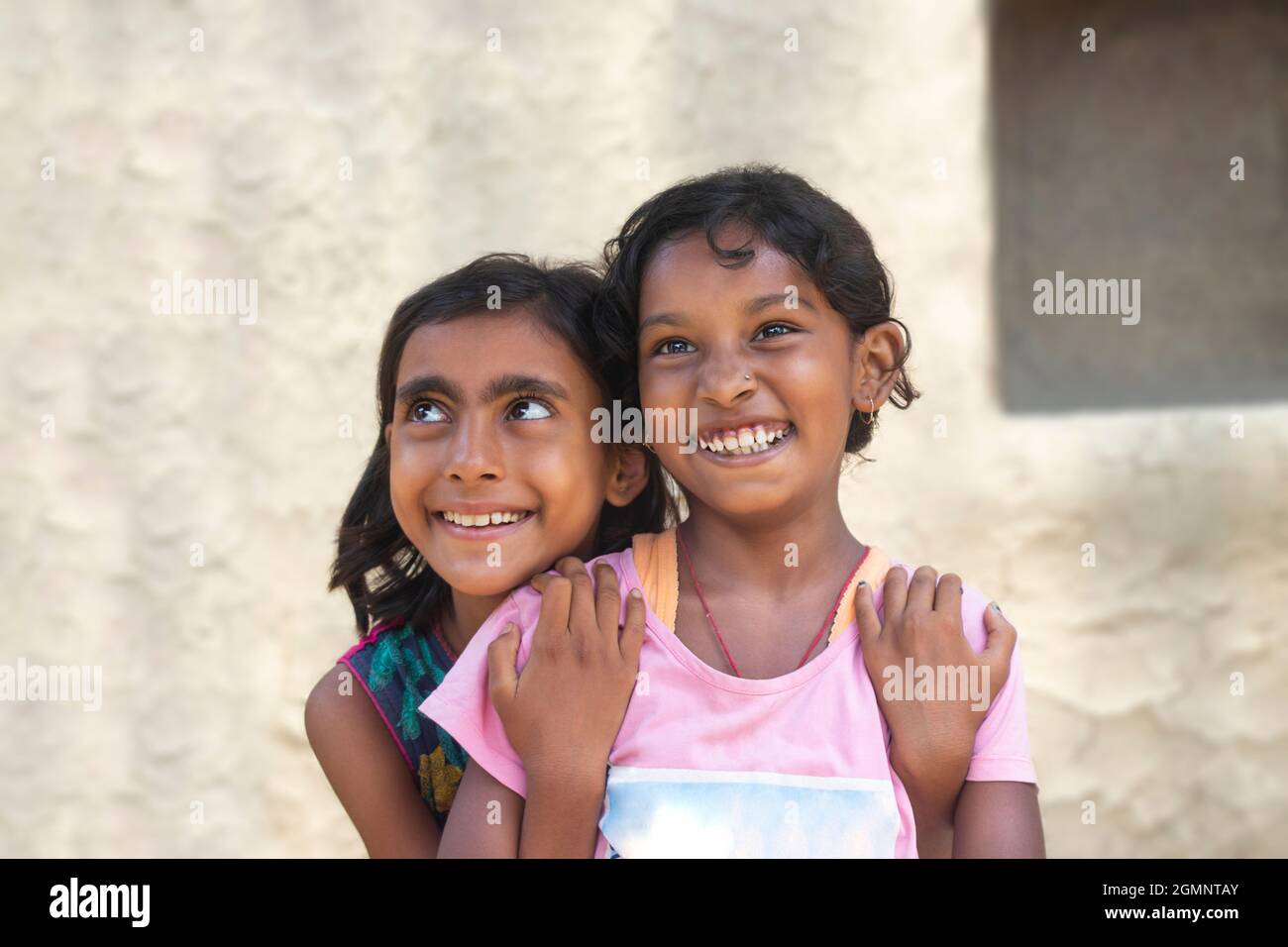 Portrait of two Rural girls embracing Stock Photo - Alamy