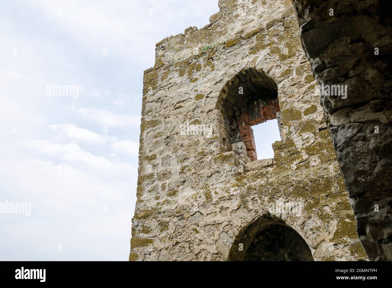 Tower windows of the ruins of an old Genoese fortress. Wall masonry ...